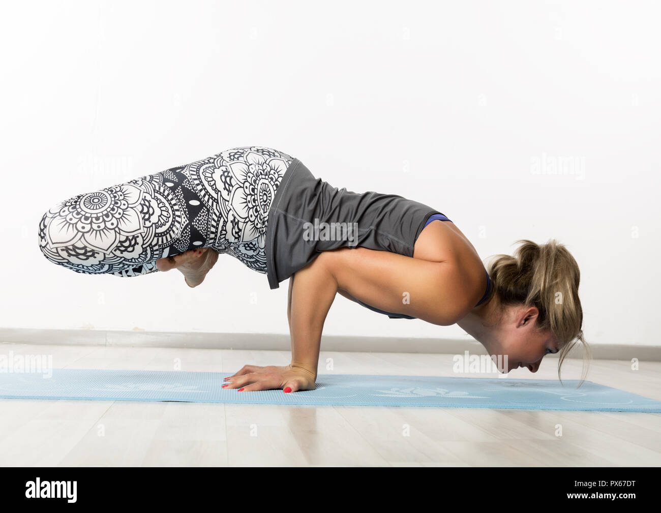 Sporty young woman practice yoga asana in class. Concept of calmness ...
