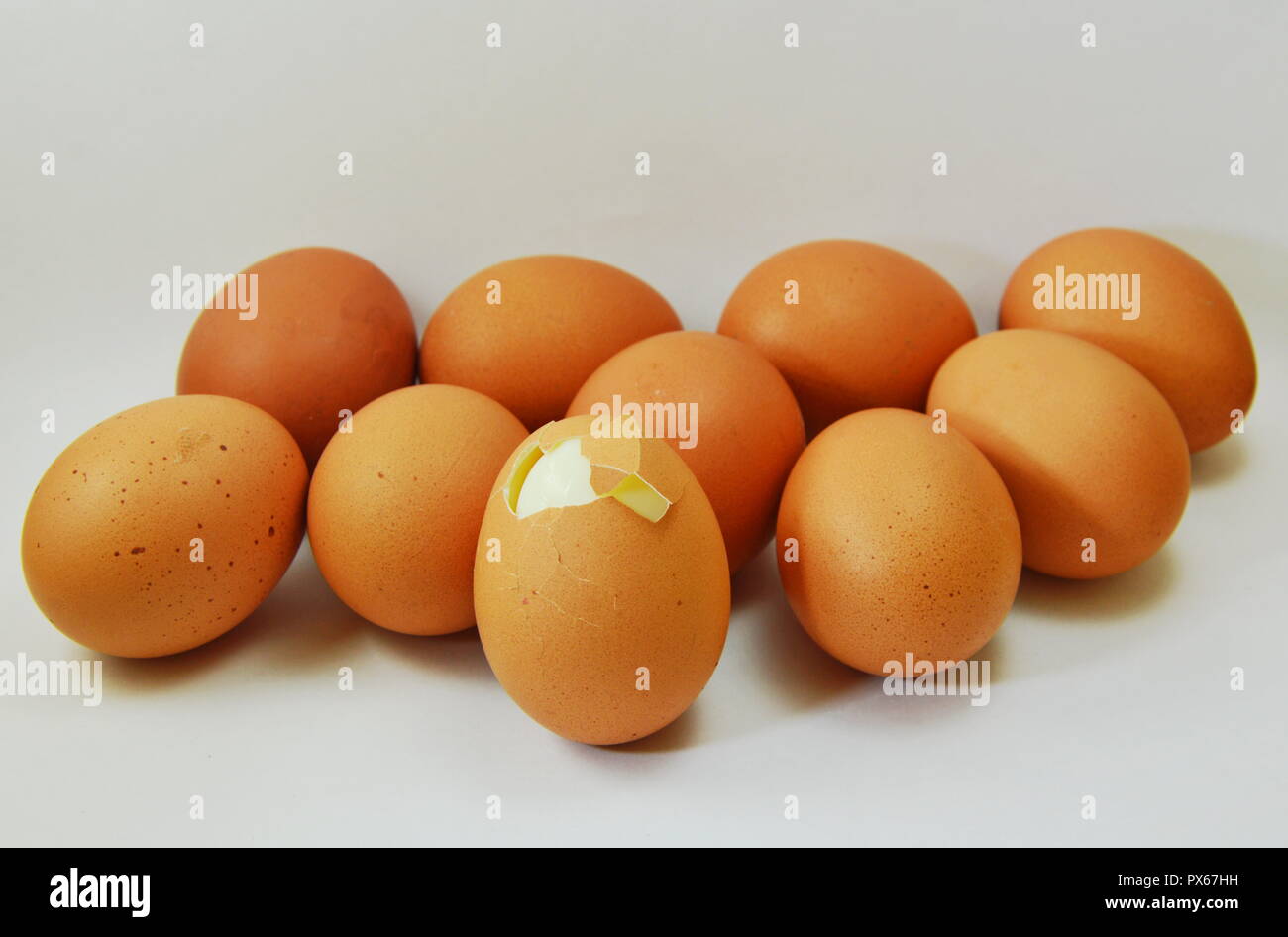 boiled egg peel shell out on white background Stock Photo - Alamy