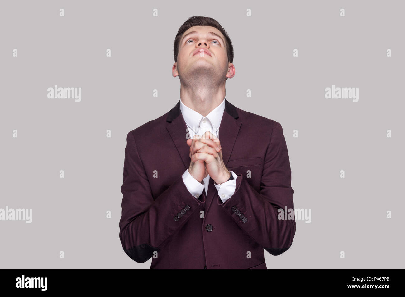 Man in suit praying looking hi-res stock photography and images - Alamy