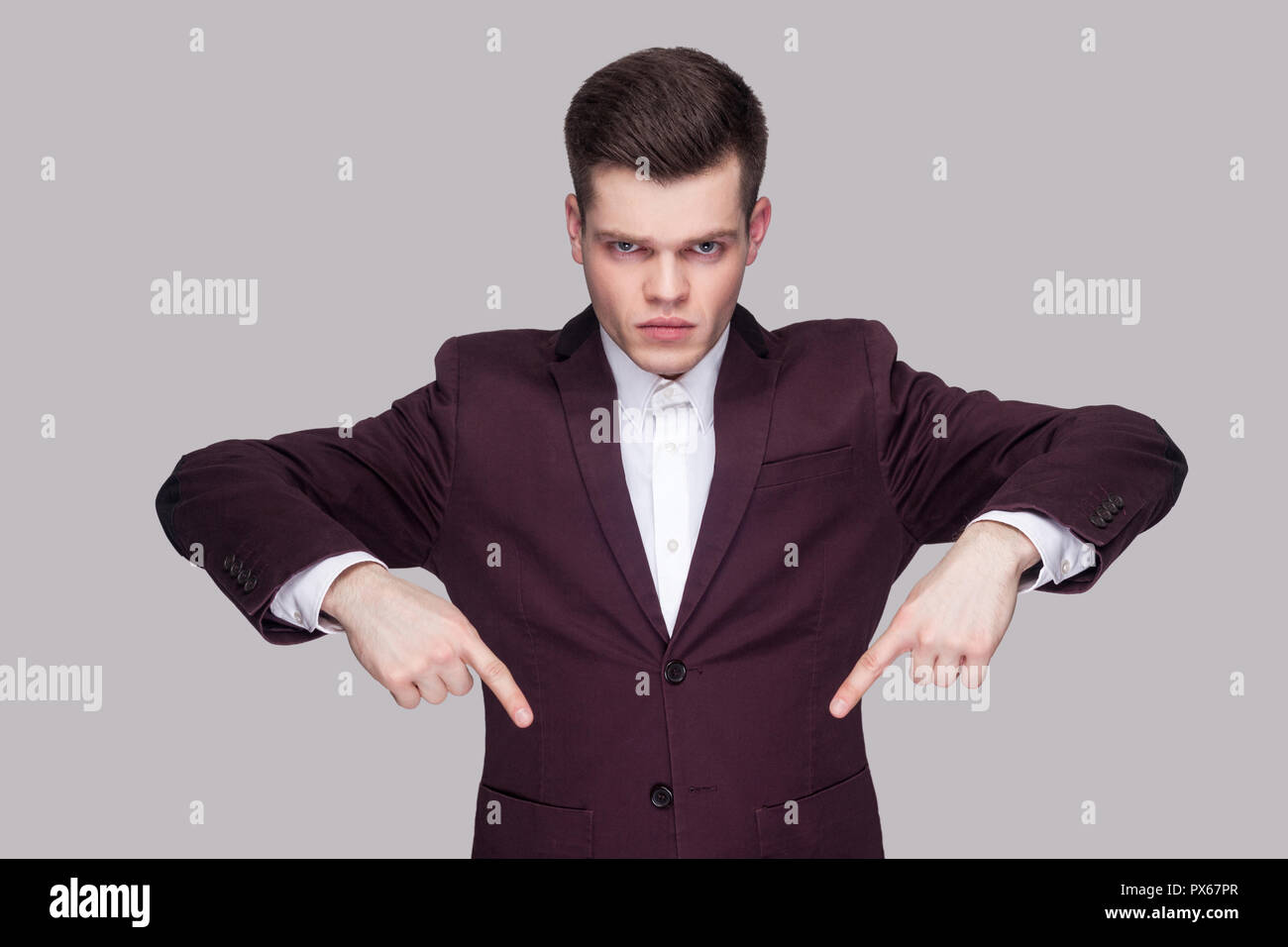 Serious young man suit hi-res stock photography and images - Alamy