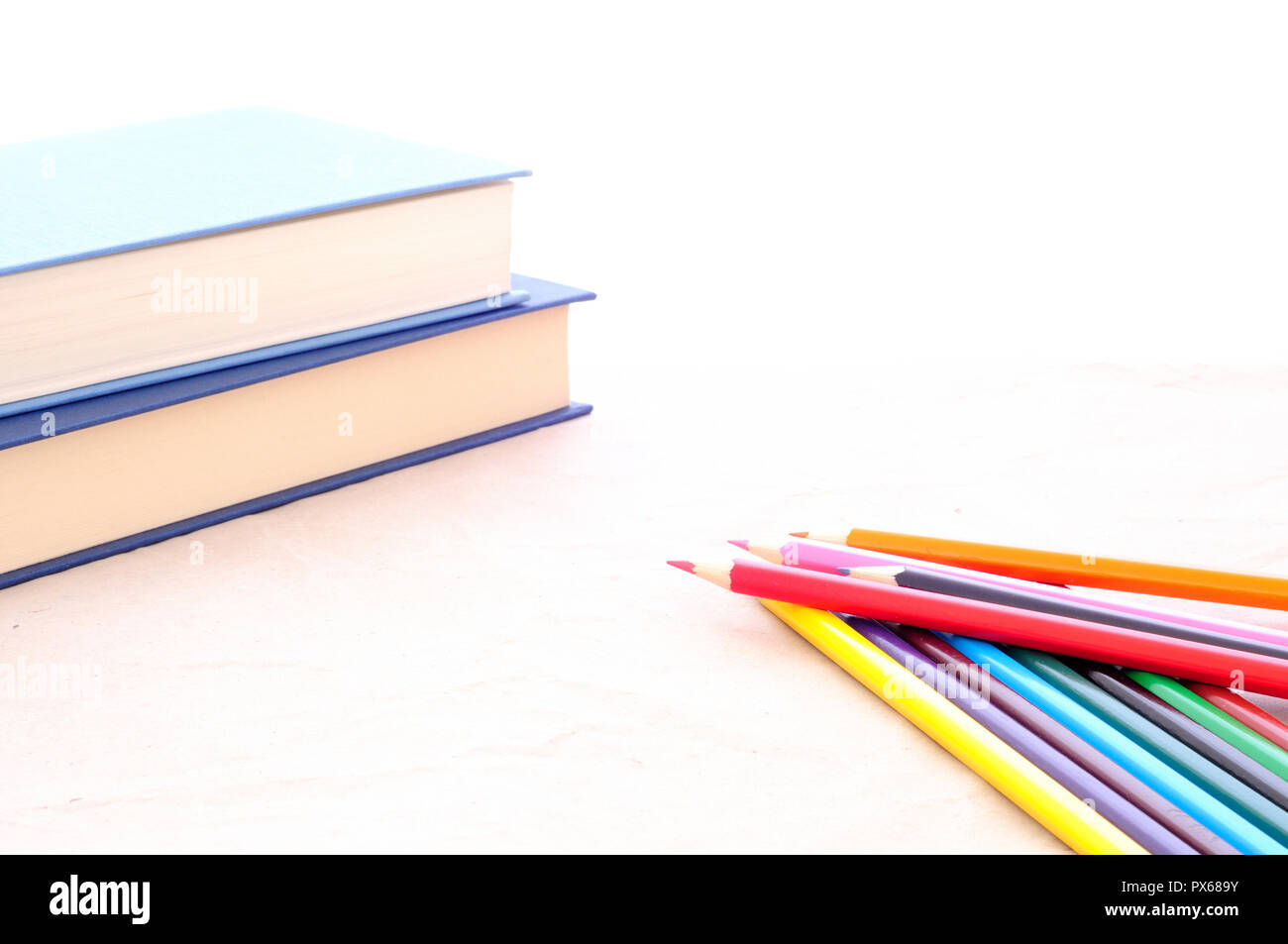 back to school, minimalist background, colored pencils and books ...