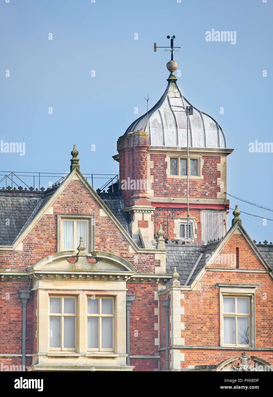 Turret style tower with weather vane at Sandringham House, the Monarch ...