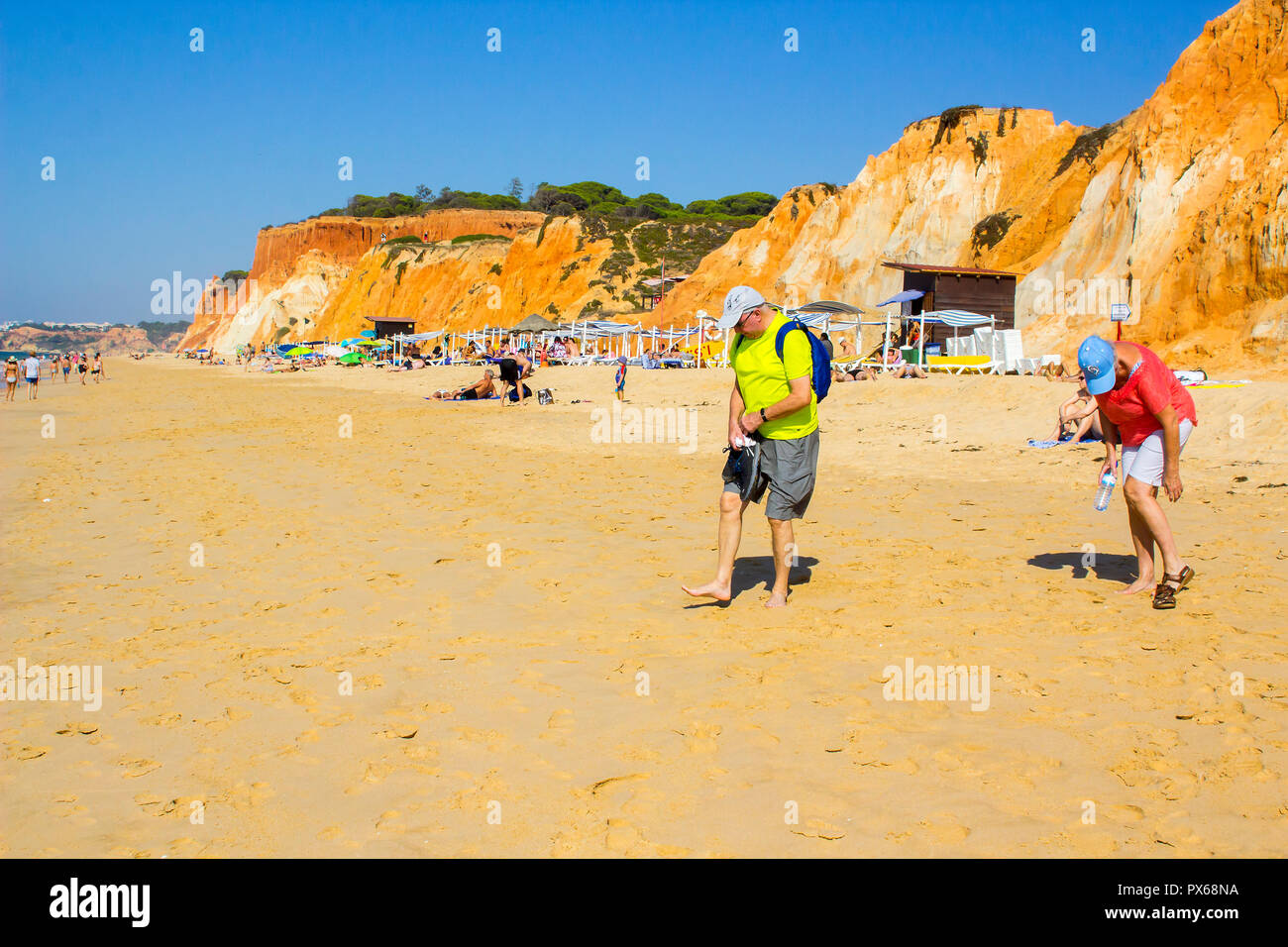28 September 2018 A couple take their shoes off as they prepare for the ...