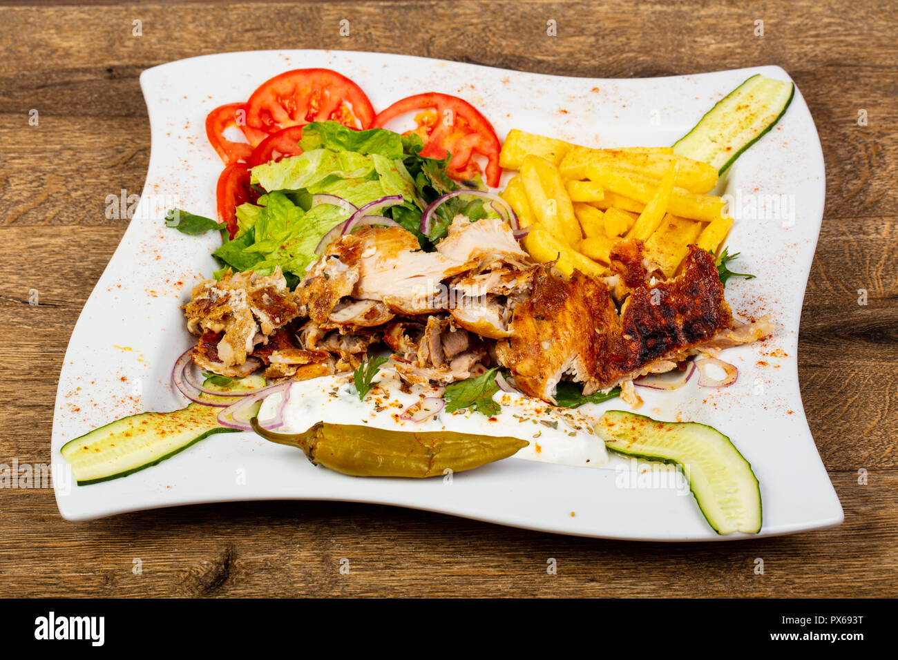 Gyros on the plate with vegetables Stock Photo - Alamy