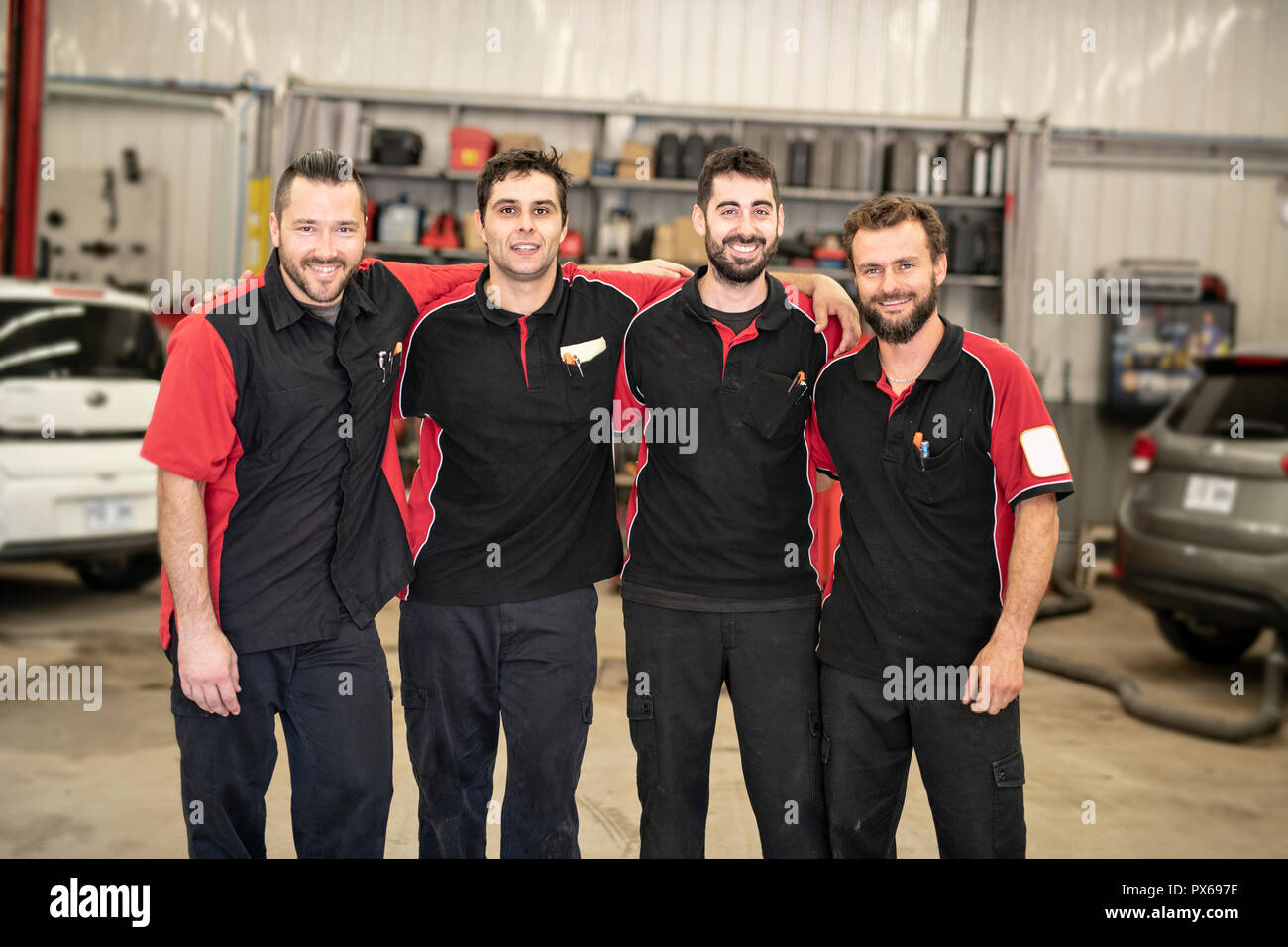 A Portrait of auto shop mechanics group together employee Stock Photo ...