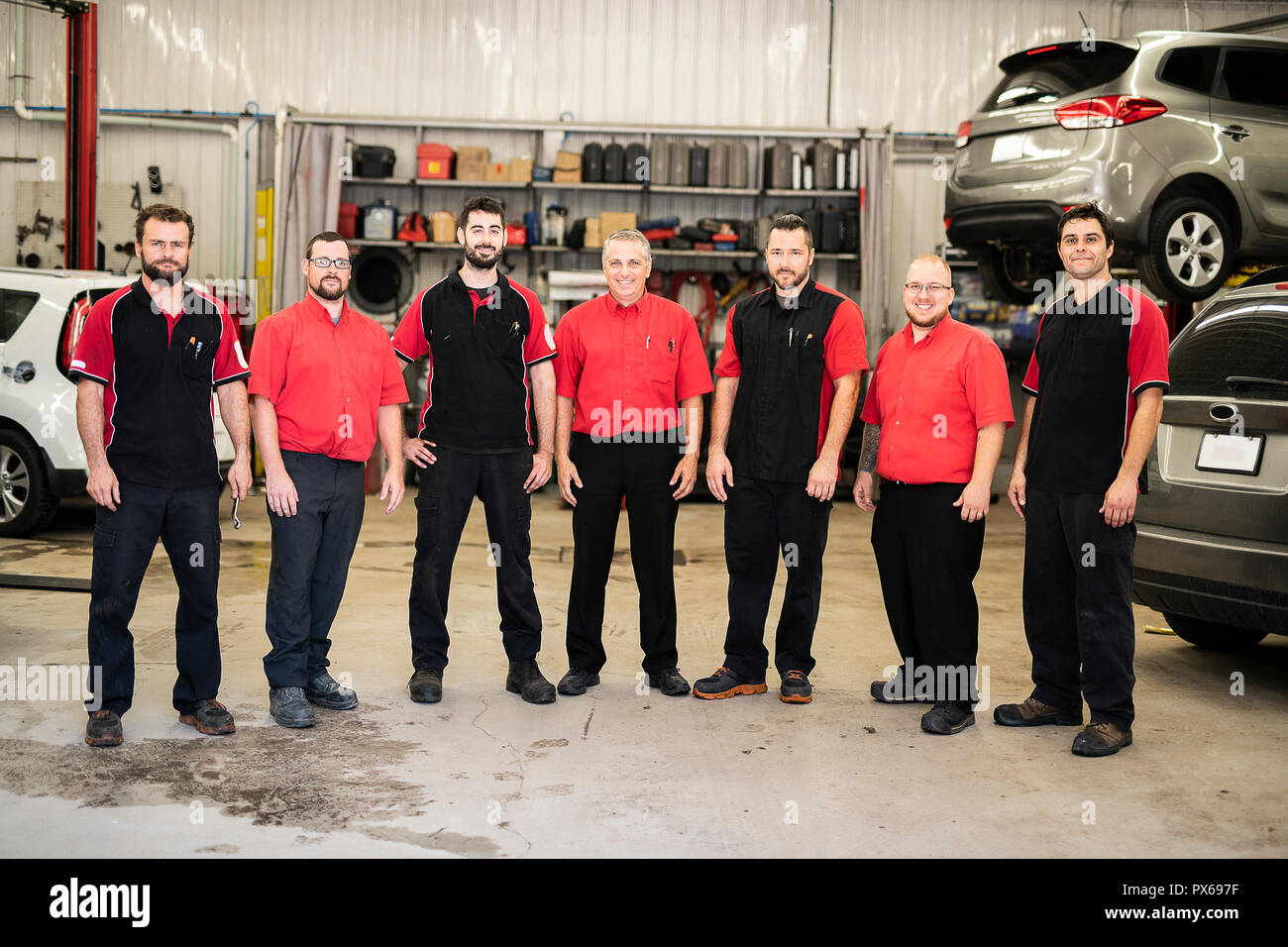 A Portrait of auto shop mechanics group together employee Stock Photo ...