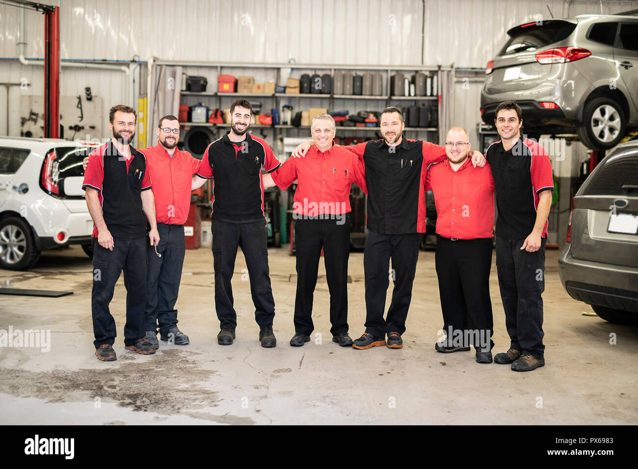 A Portrait of auto shop mechanics group together employee Stock Photo ...
