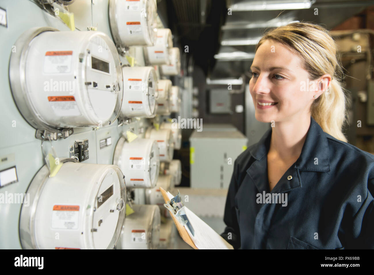 A great Woman Technician servicing at work Stock Photo - Alamy