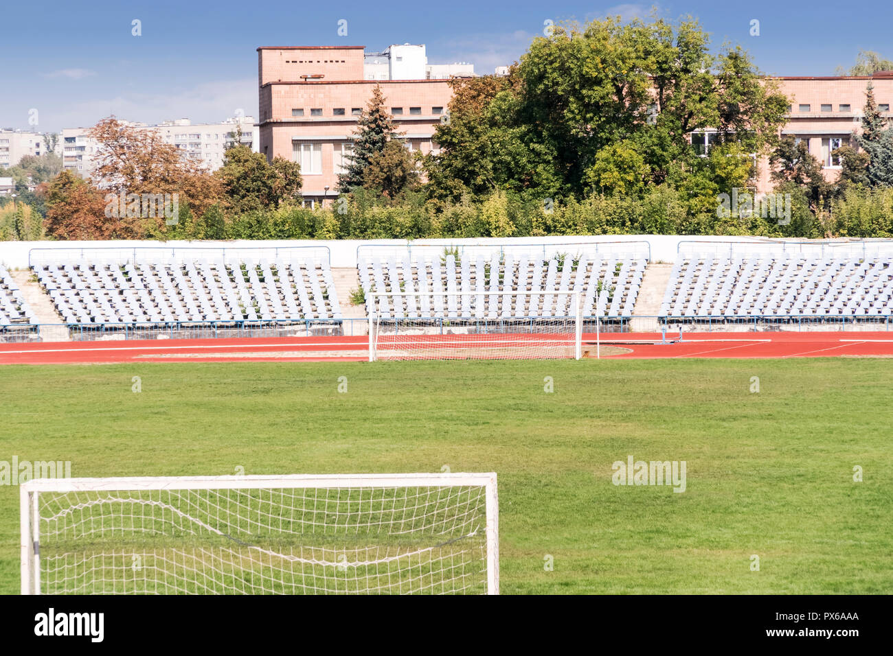 Old football stadium with stands, overgrown bushes stands Stock Photo ...