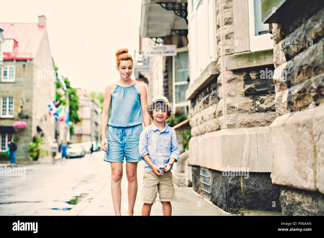 A mother with her son outside in an urban street Stock Photo - Alamy