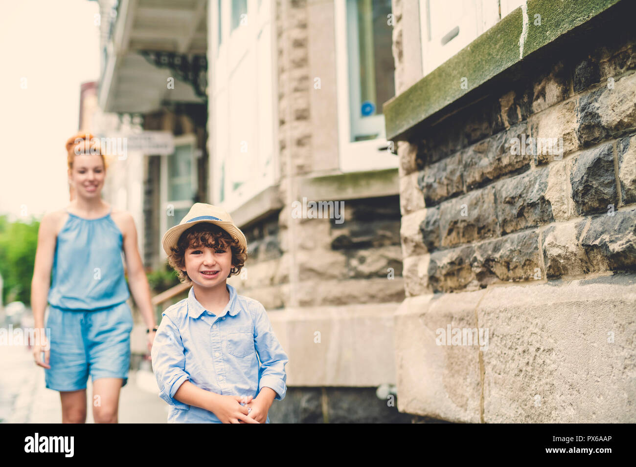 A mother with her son outside in an urban street Stock Photo - Alamy