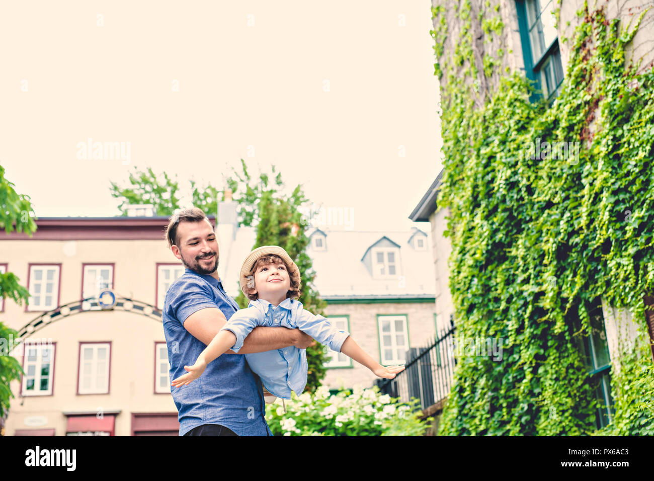 A dad with her son outside in a urban street Stock Photo - Alamy