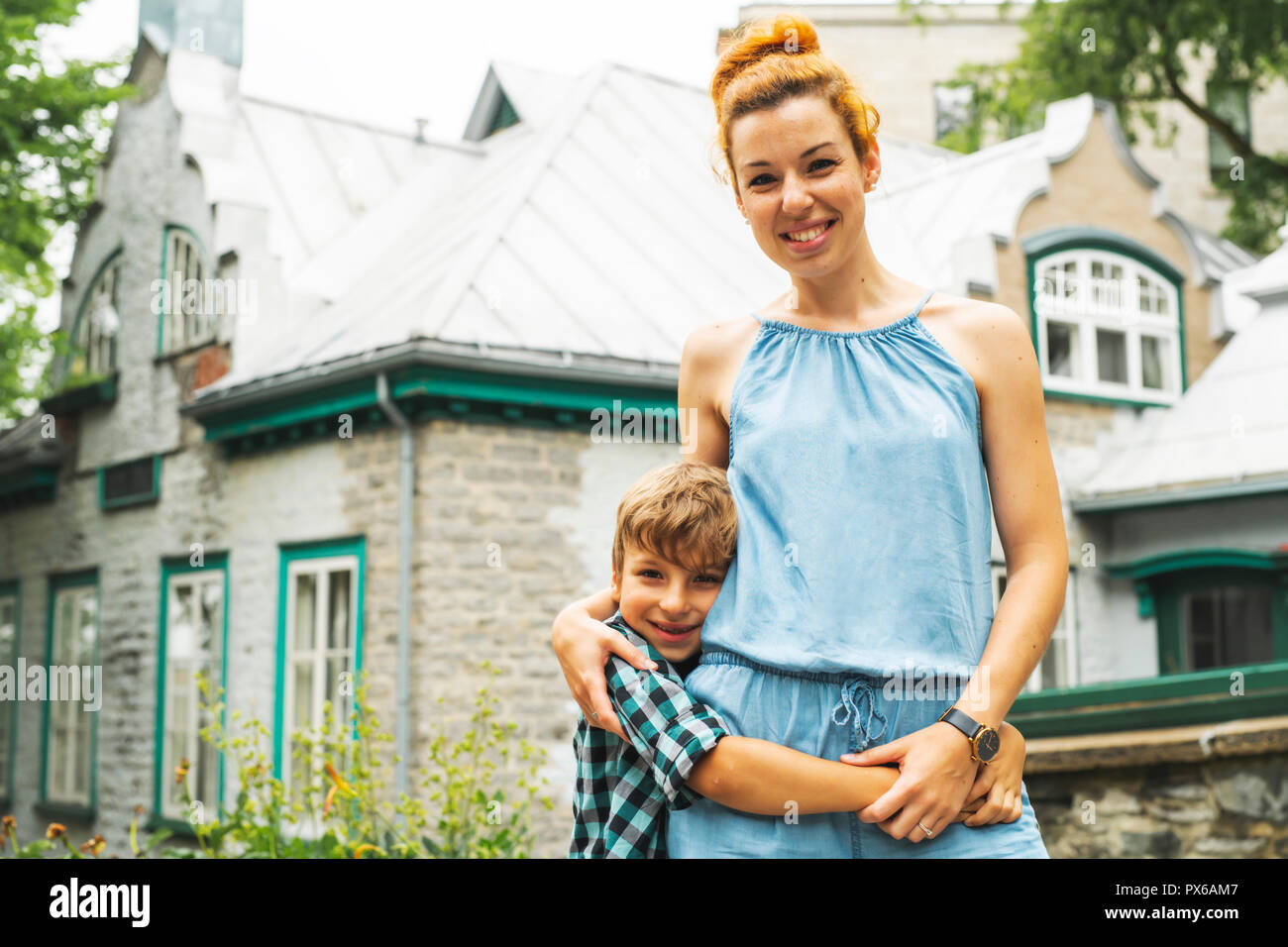 A mother with her son outside in an urban street Stock Photo - Alamy