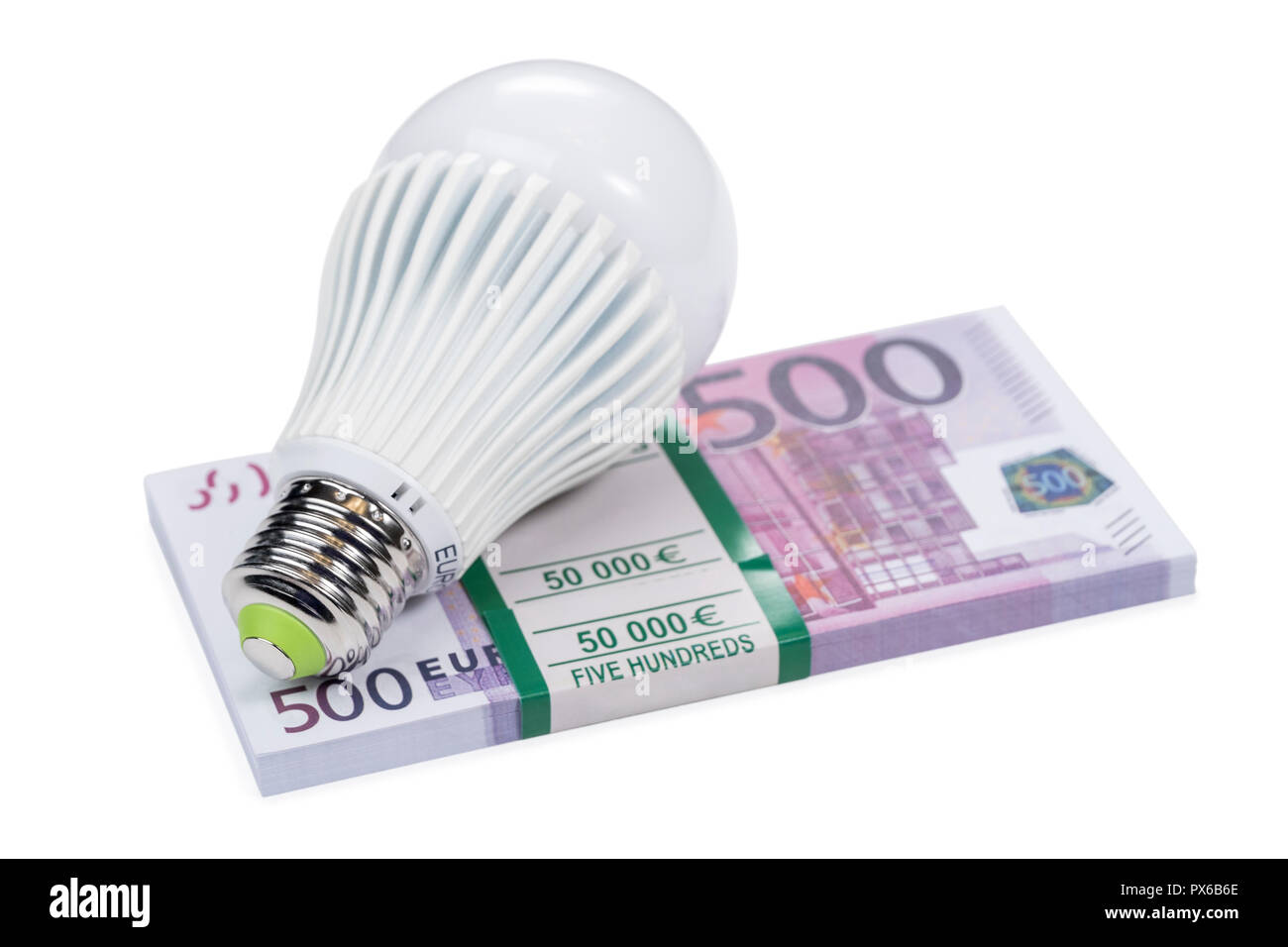 big led lamp on a bundle of money with a face value of five hundred ...