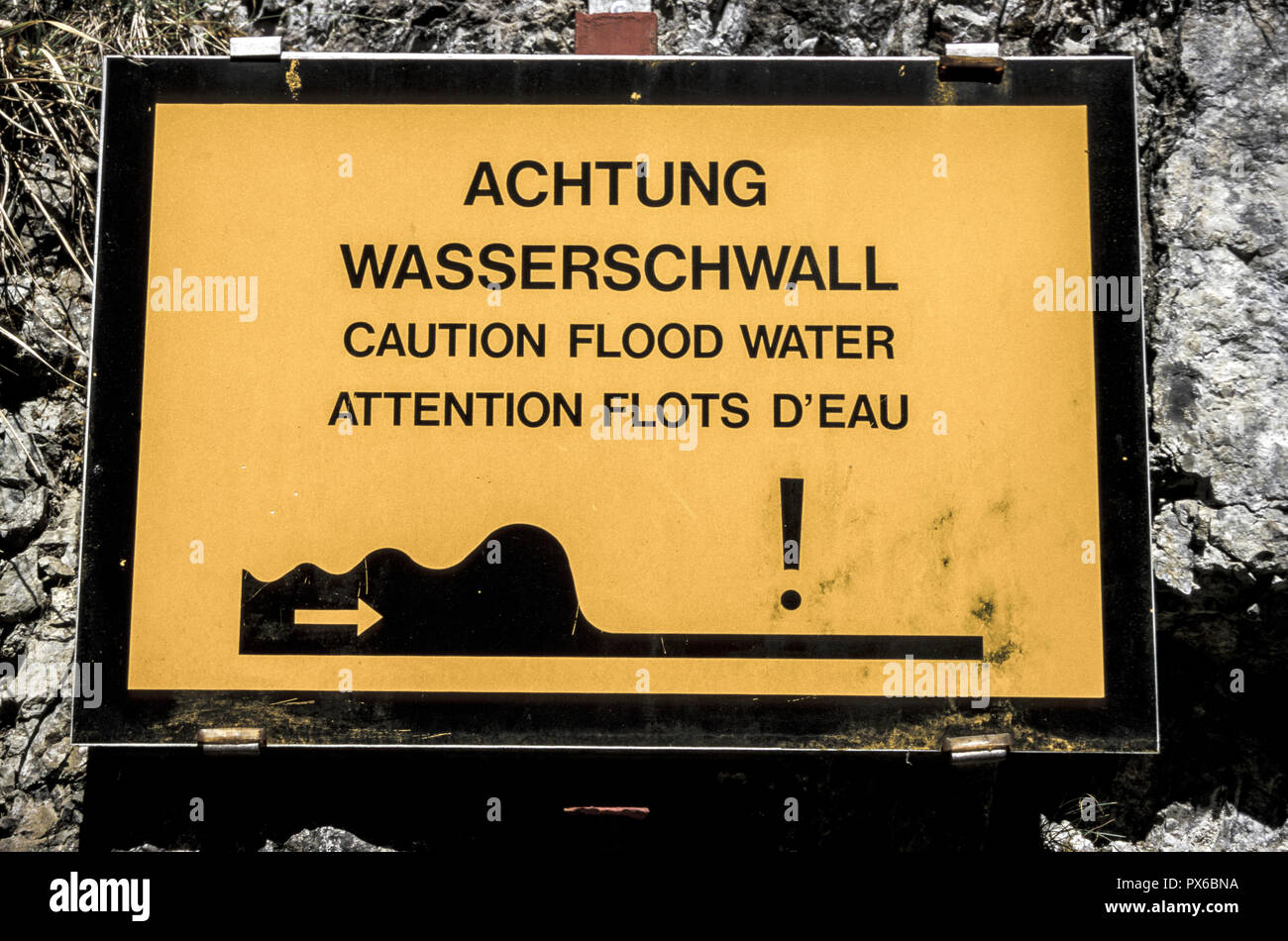 Sign caution flood water Stock Photo - Alamy