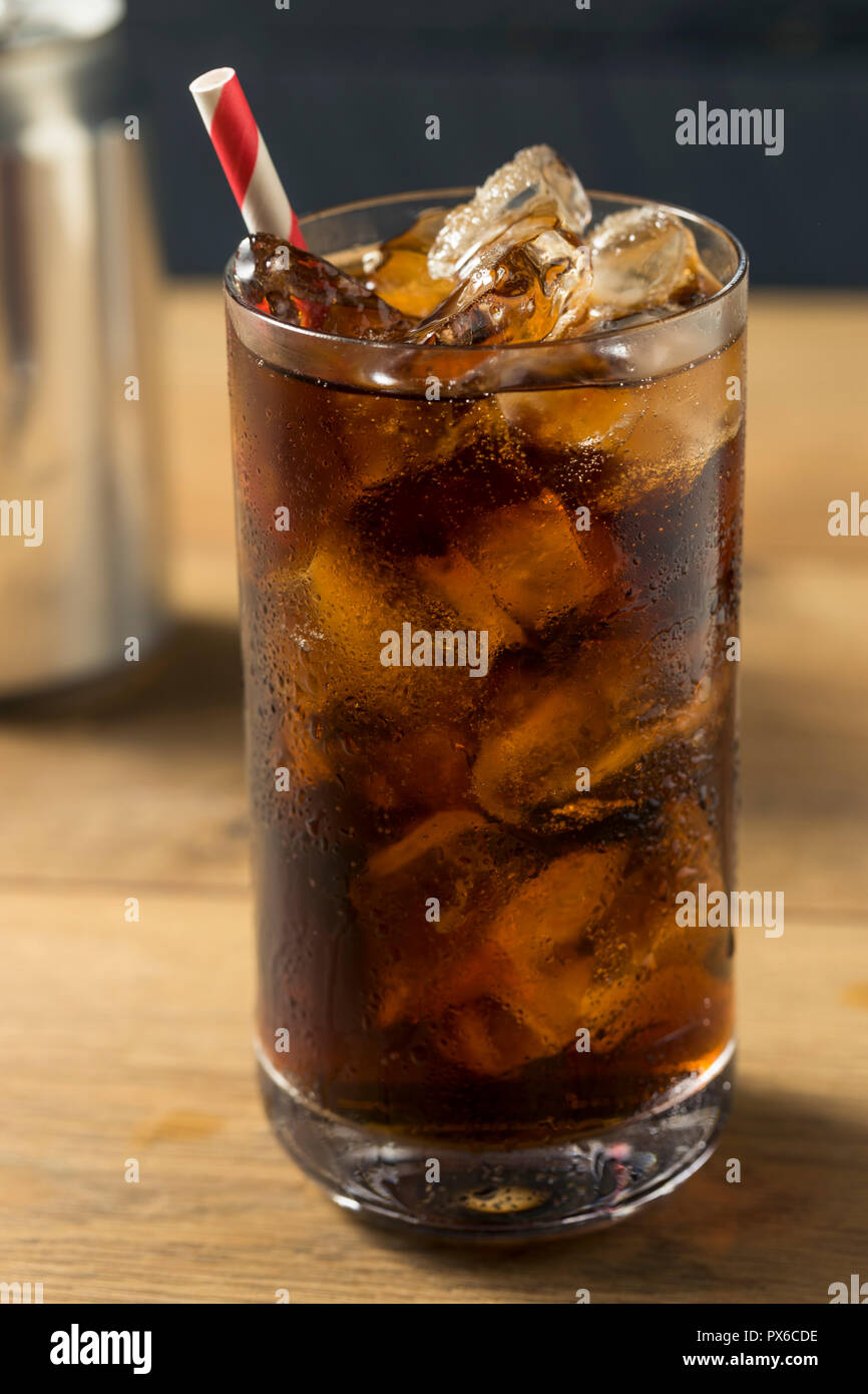 Bubbly Refreshing Dark Soda with Ice in a Glass Stock Photo - Alamy