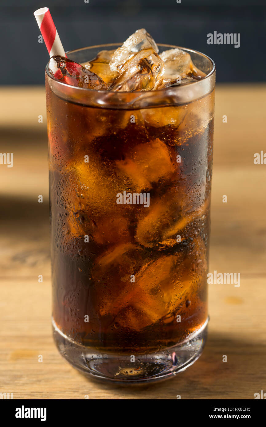 Bubbly Refreshing Dark Soda with Ice in a Glass Stock Photo - Alamy