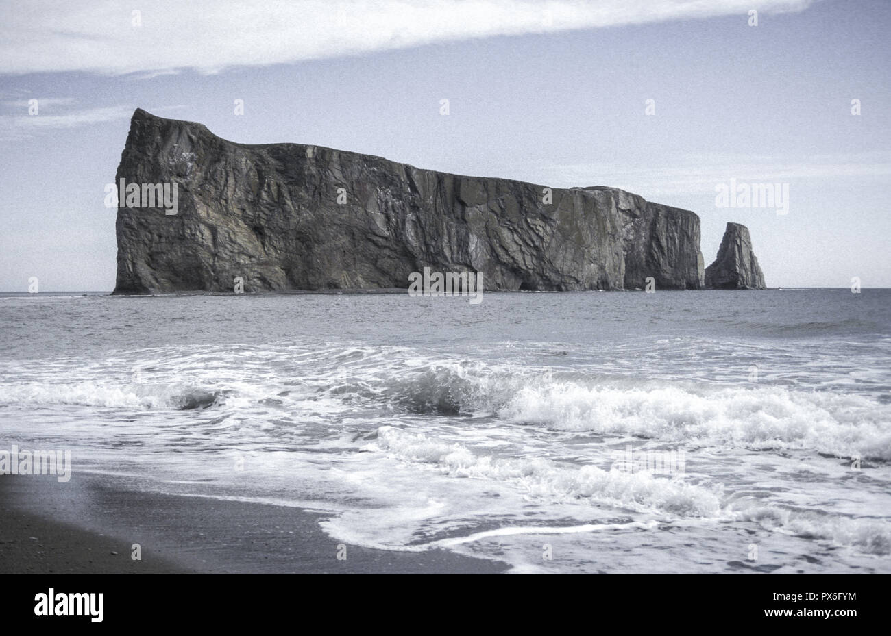 Rock of Perce, rock in the surf, Canada, Quebec, Gaspe peninsula Stock ...
