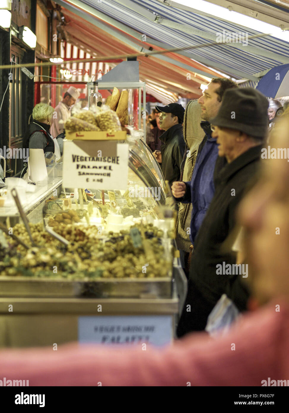Naschmarkt bustling activities at a market stand, Austria, Vienna, 5 ...