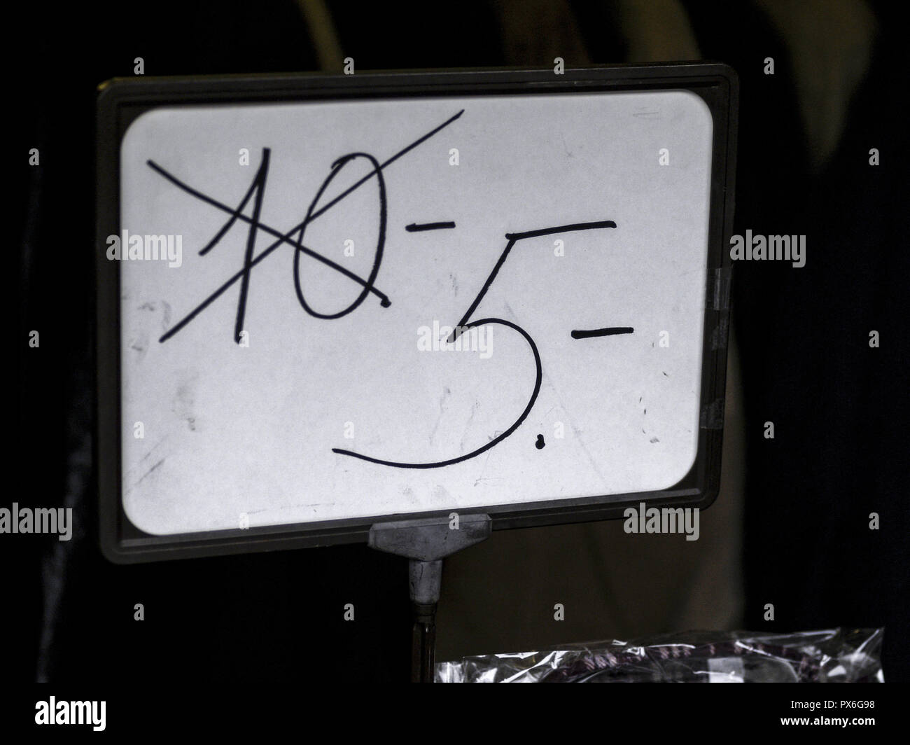 Naschmarkt price label 10 crossed out 5 sale Stock Photo - Alamy