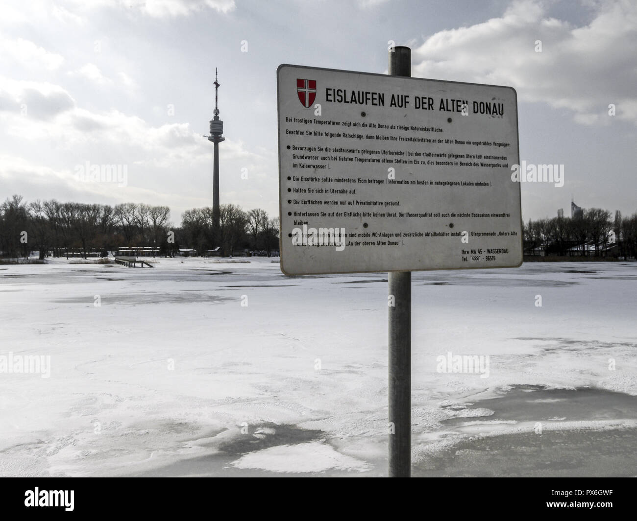Ice skating rink at Alte Donau in the winter with signboard, Austria ...