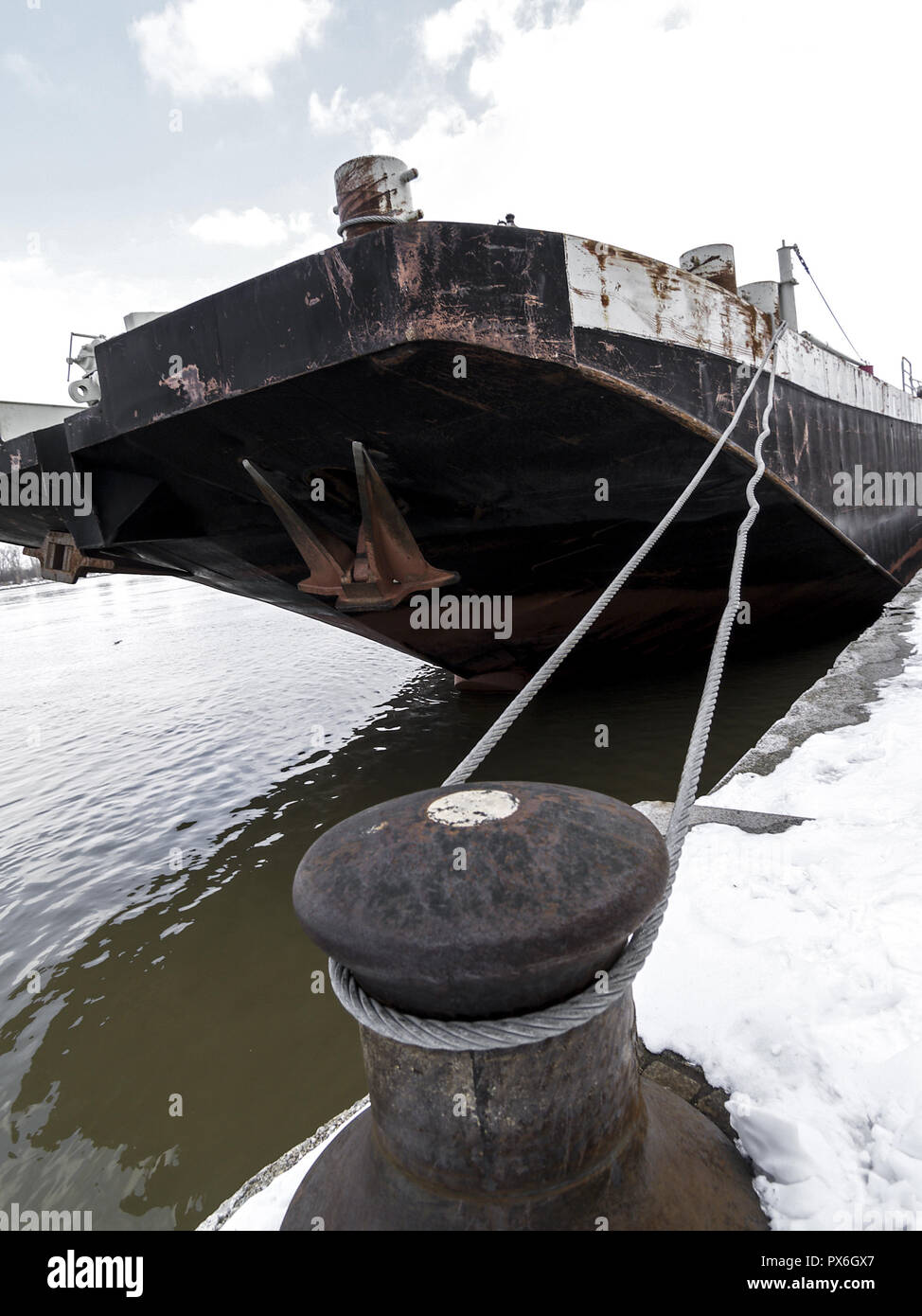 Rusty cargo ship at the river bank Stock Photo - Alamy