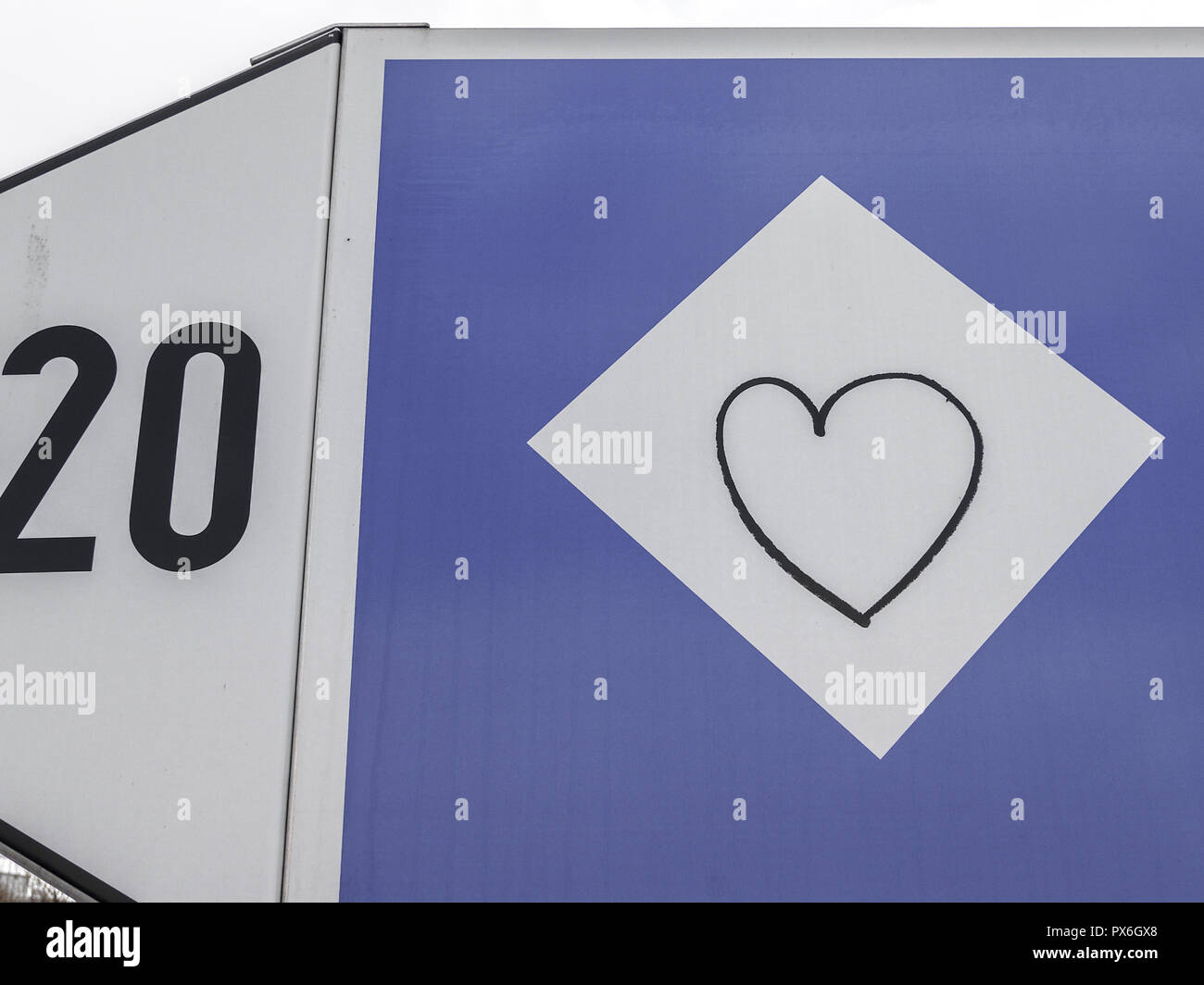 Blue traffic sign with a heart painted on Stock Photo - Alamy