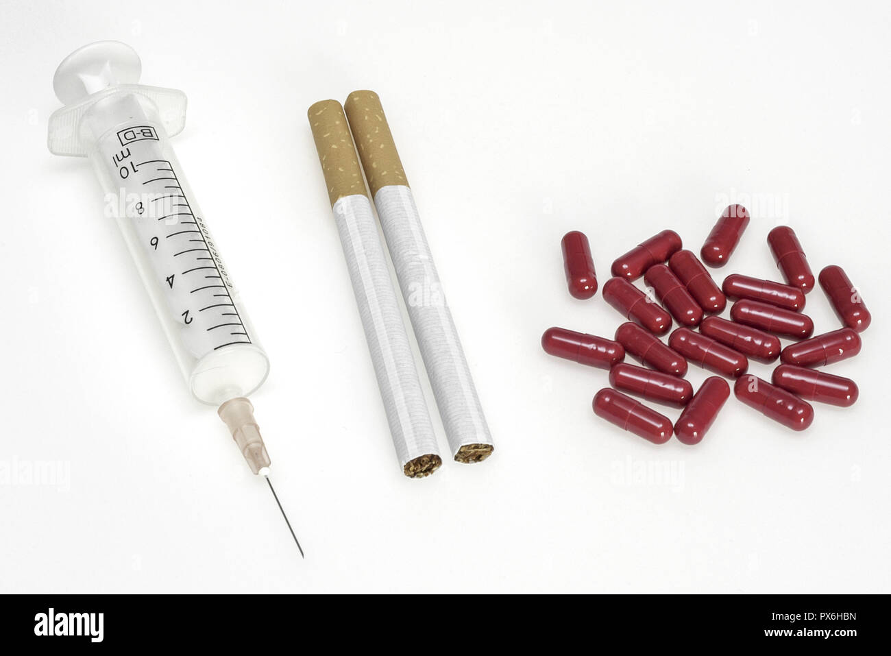 Pills, injection and cigarettes Stock Photo - Alamy