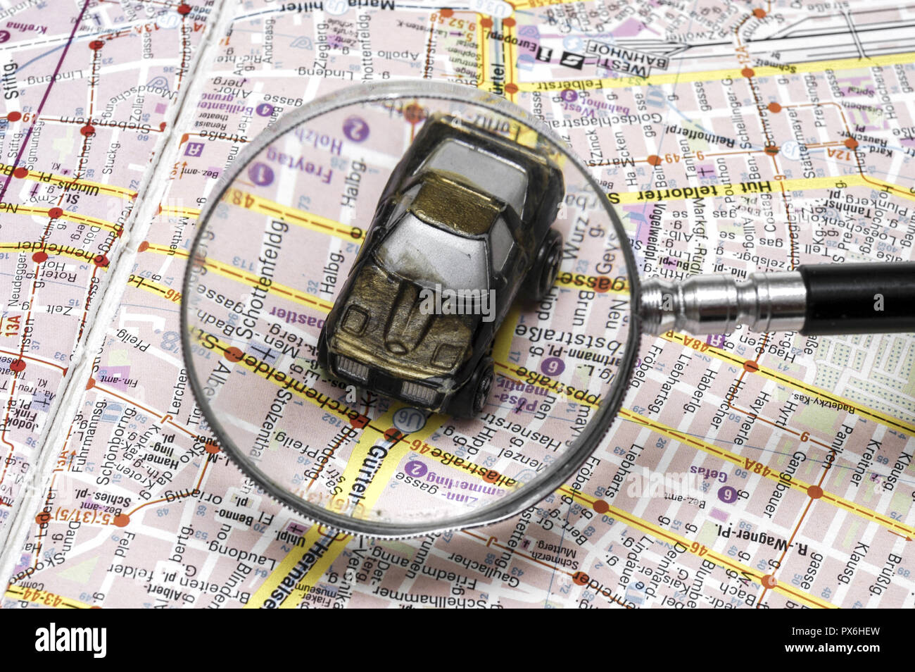 Car on a map Stock Photo - Alamy