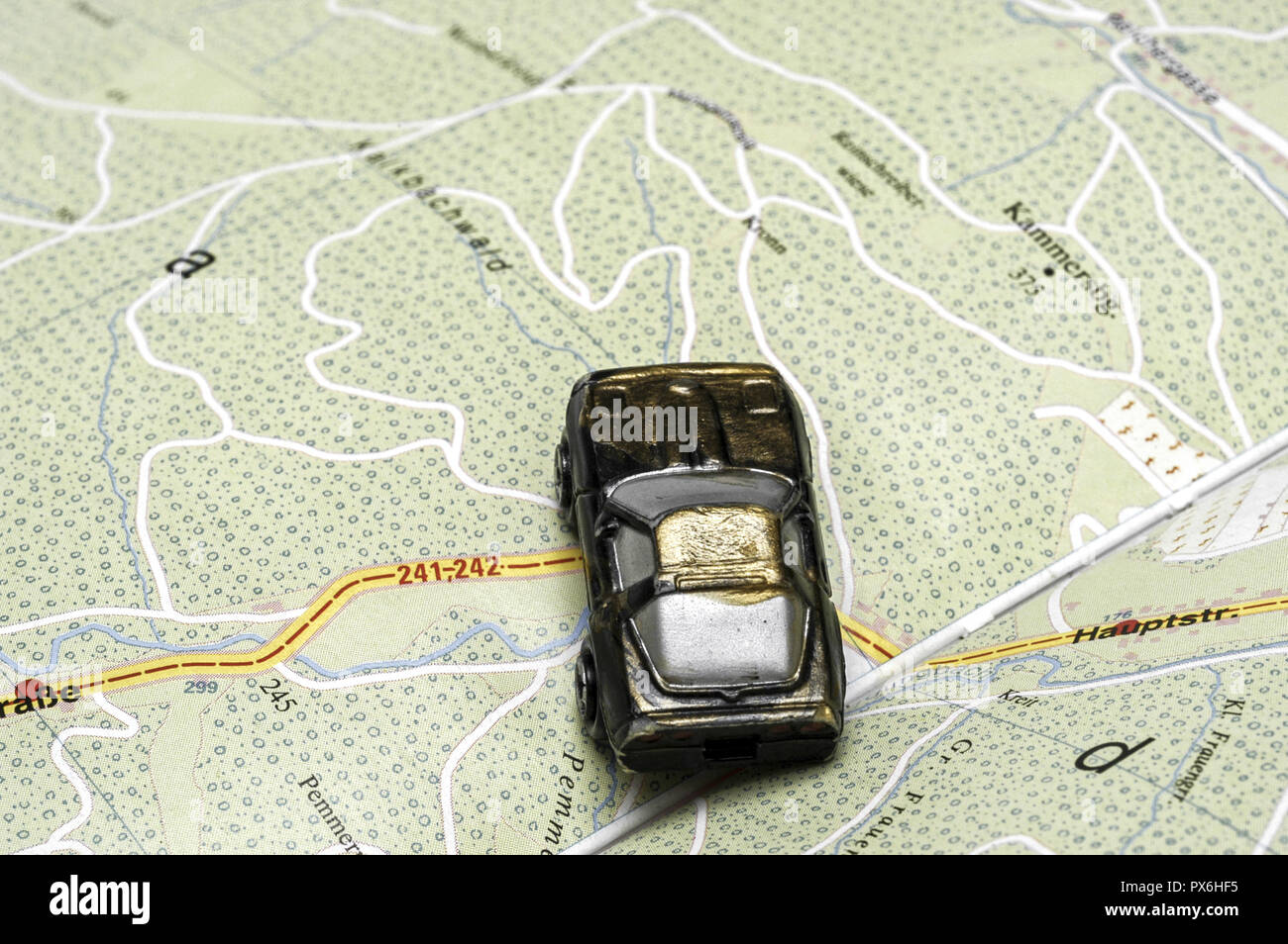 Car on a map Stock Photo - Alamy