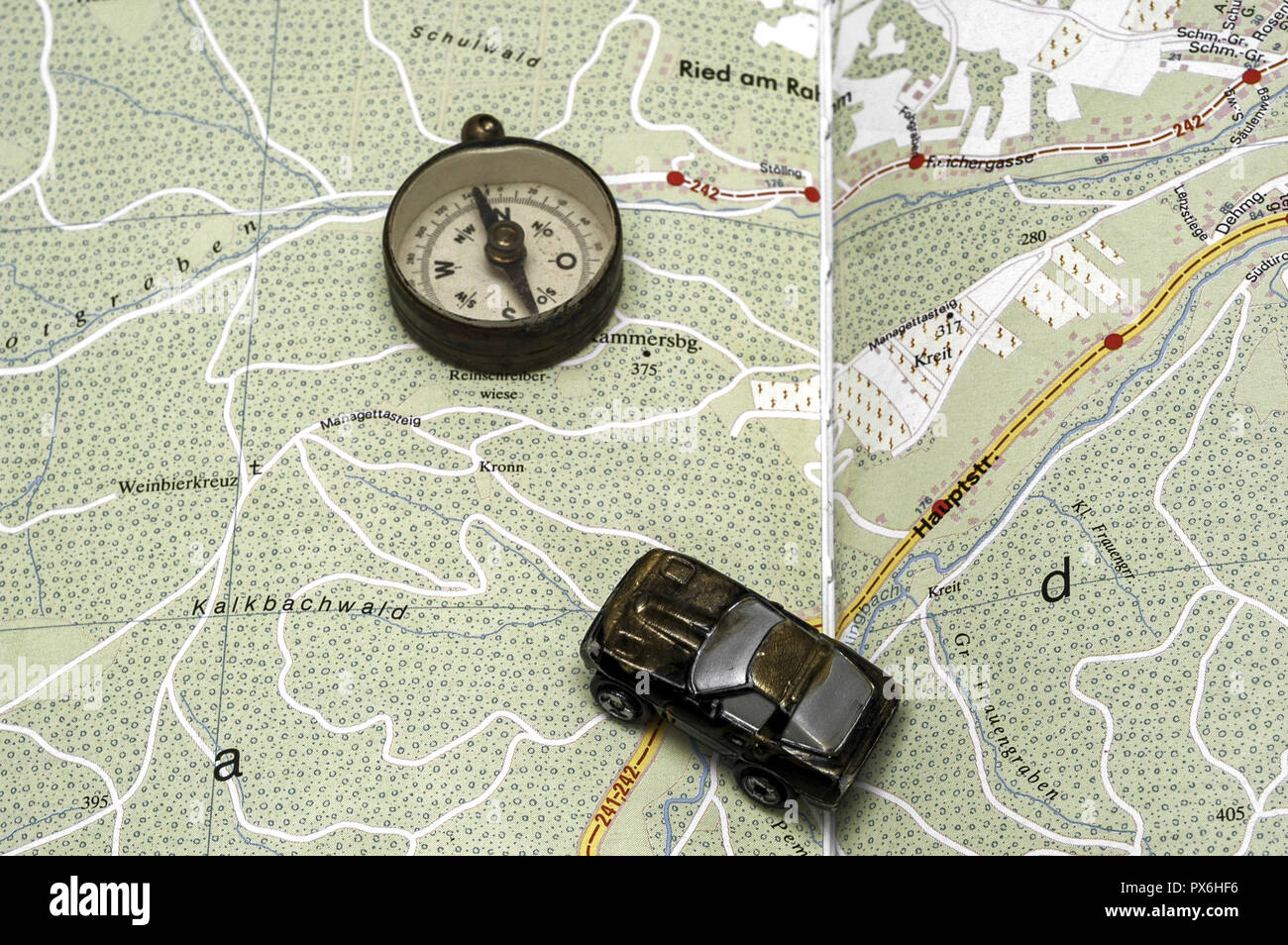 Car on a map, compass Stock Photo - Alamy