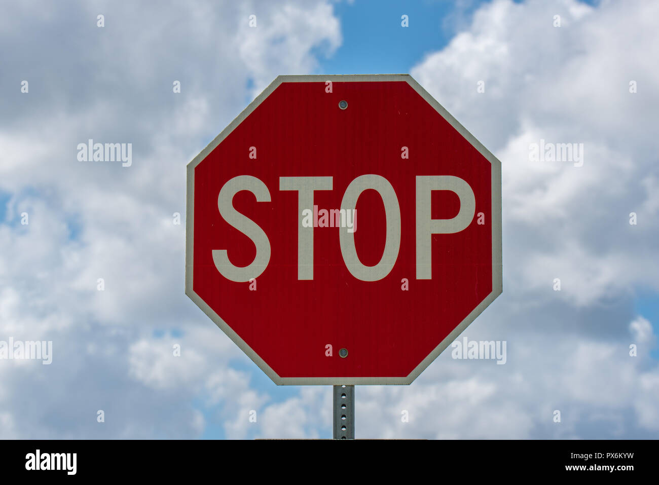Stop sign against a cloud sky Stock Photo - Alamy