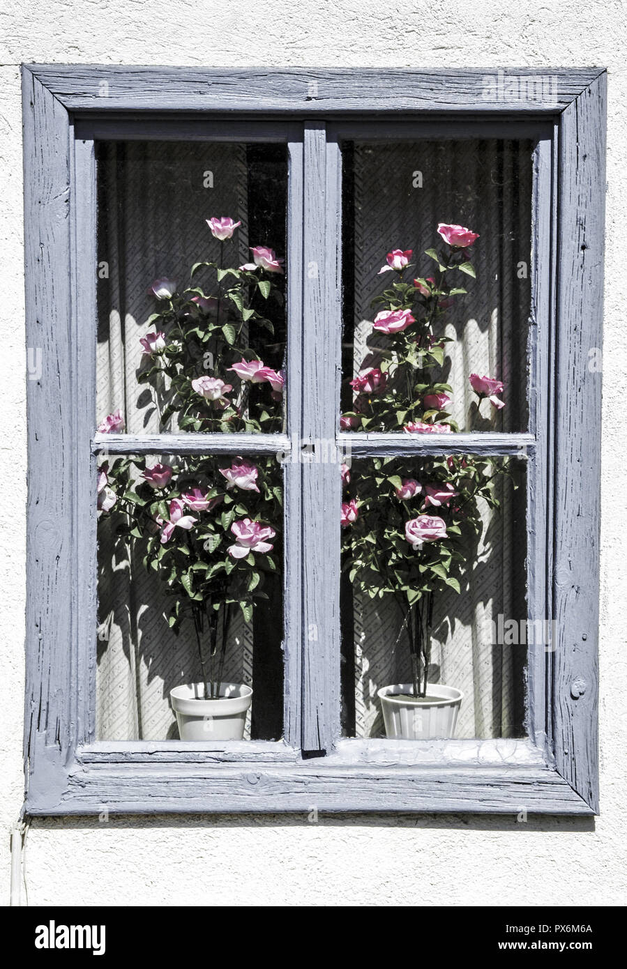 Blue window frame, flower decoration in the window Stock Photo - Alamy