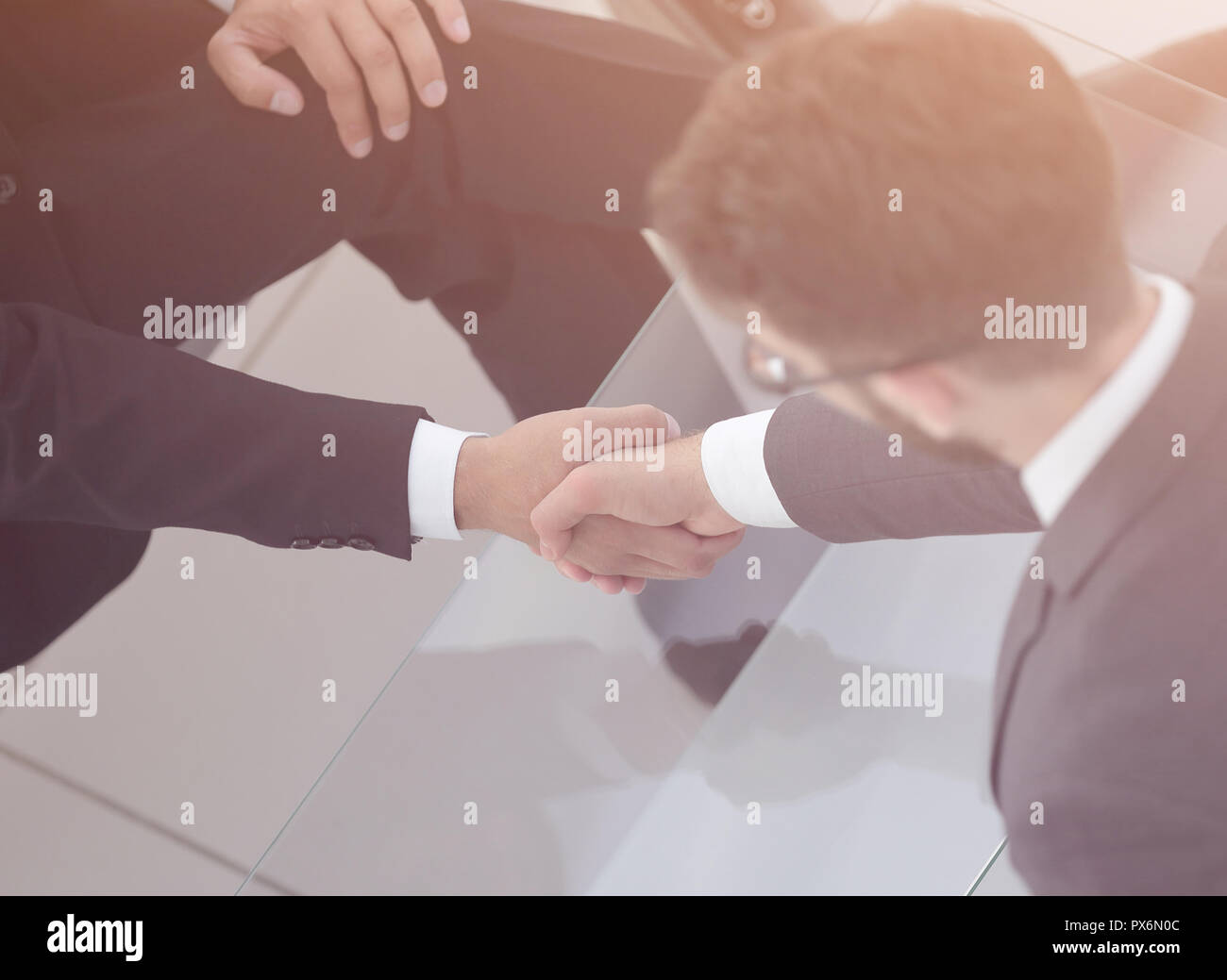 view from the top. handshake Manager and the client in the office Stock ...
