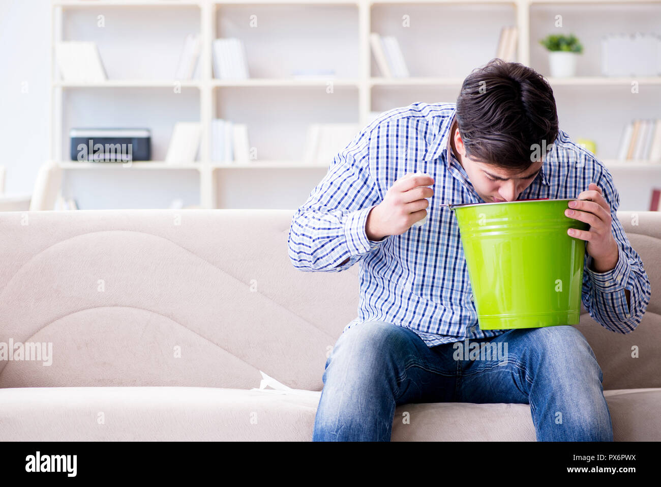 Sick man suffering at home from infection and bad stomach Stock Photo ...