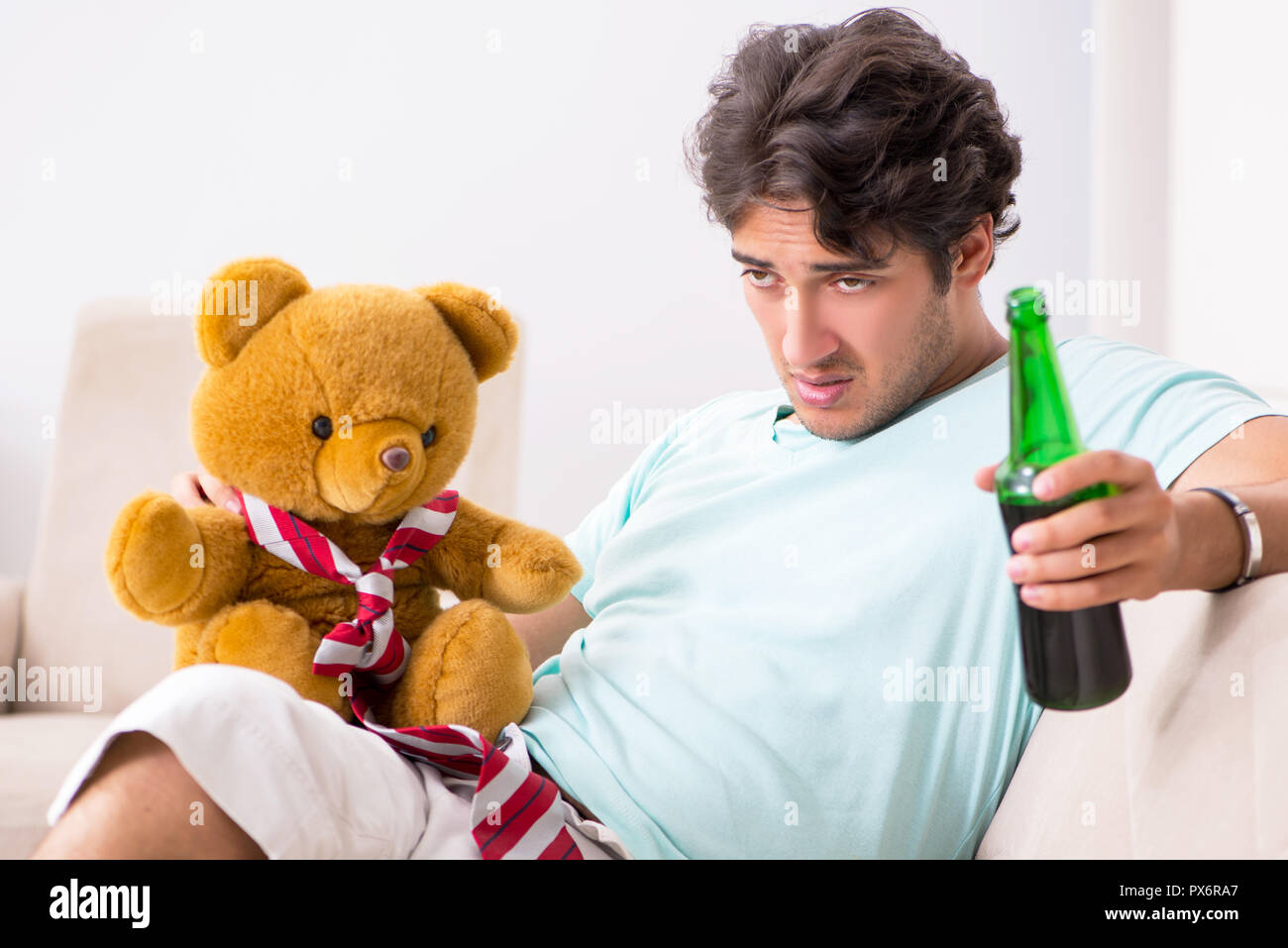 Young drunk handsome man after party at home Stock Photo - Alamy