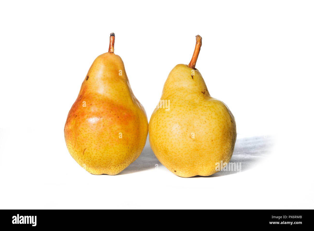 Two yellow pears isolated on white background Stock Photo - Alamy