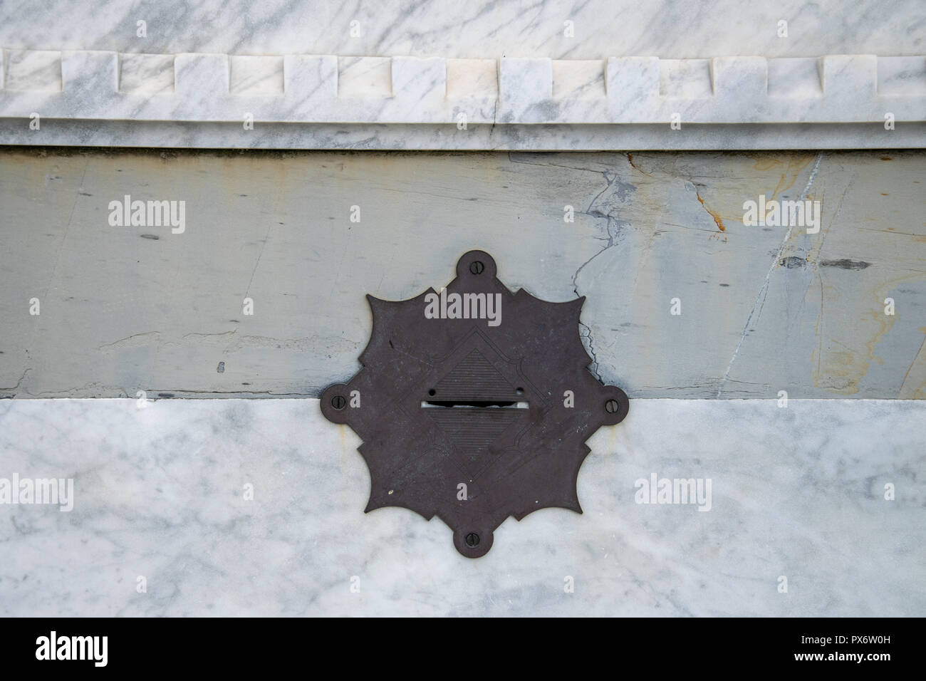 Metal facing plate on church wall Stock Photo - Alamy