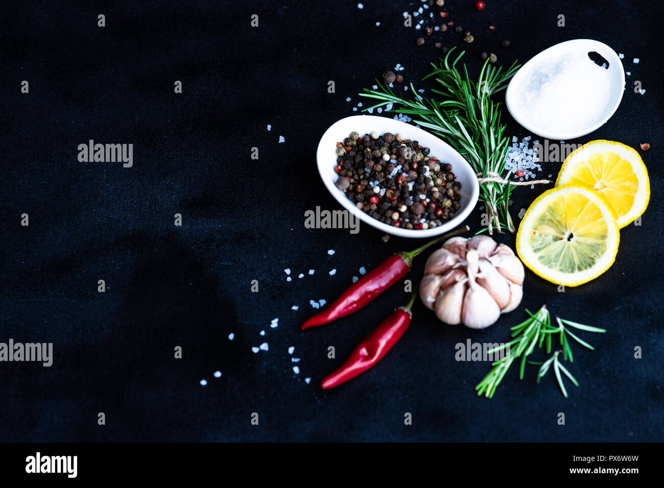 Herbs and spices on dark wooden background as a cooking ingredients ...