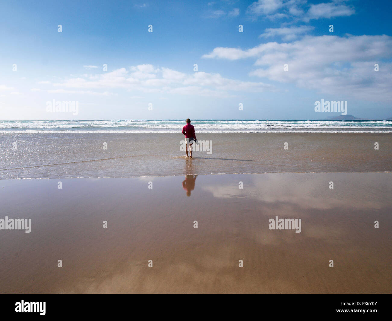 Lanzarote, Spain - June 4, 2017: Woman on the shore of Famara Beach ...