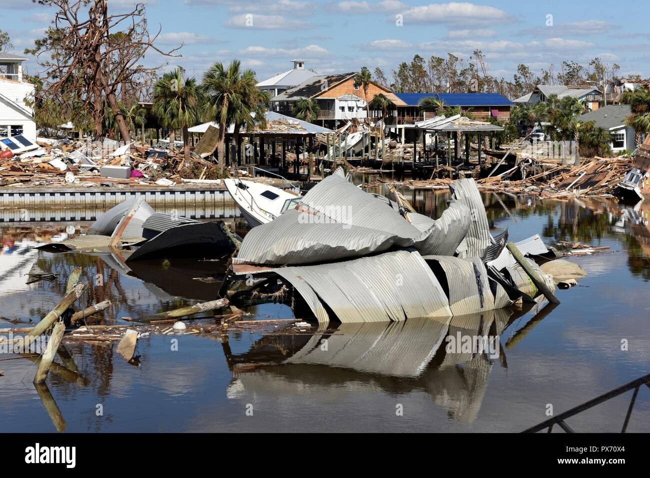 Catastrophic damage to a docks, boats and the marina in the aftermath ...