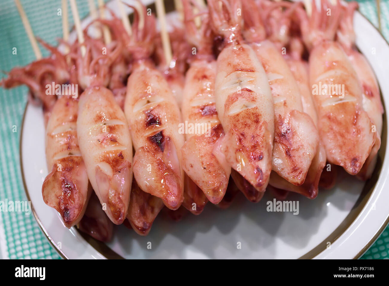 Ikayaki, grilled squid skewers, Japanese street food, at Nishiki food ...