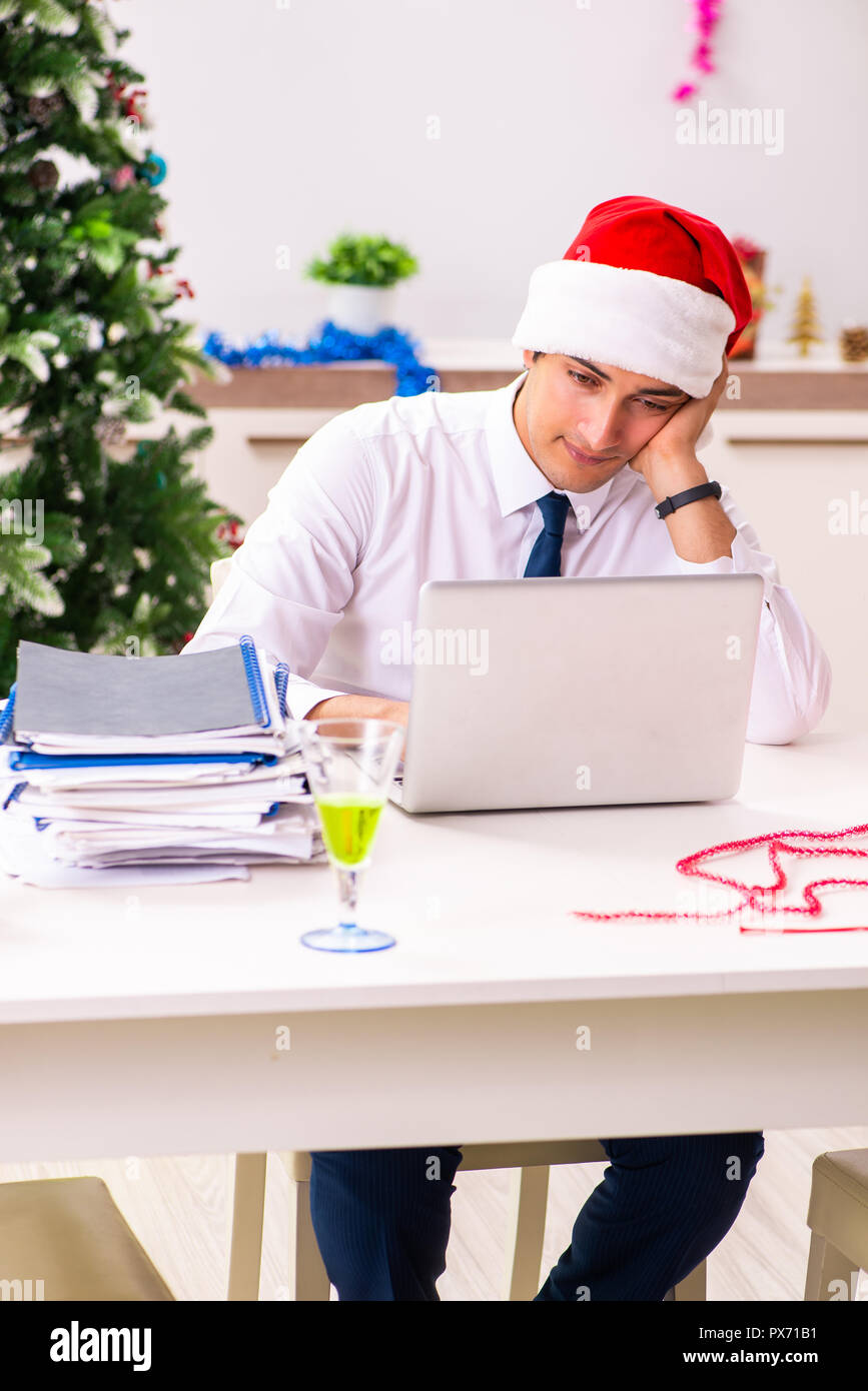 Employee businessman celebrating christmas in office Stock Photo - Alamy