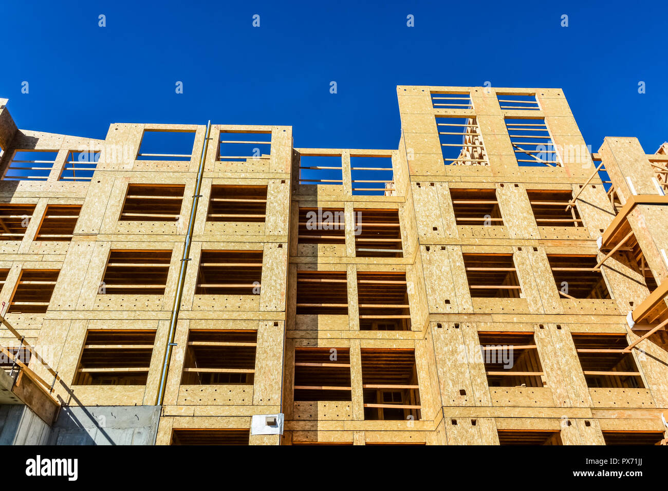 New low rise building under construction on blue sky background Stock ...