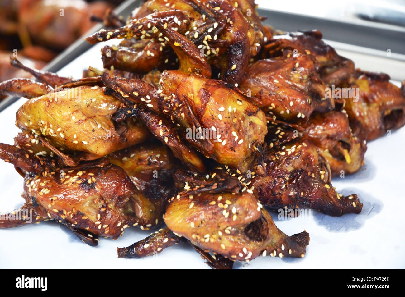 full of freshly roasted quails Stock Photo - Alamy