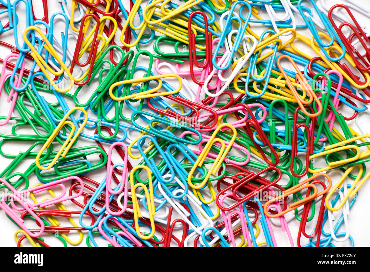 Colorful (Red, green, yellow, pink, blue) paper clip on white ...