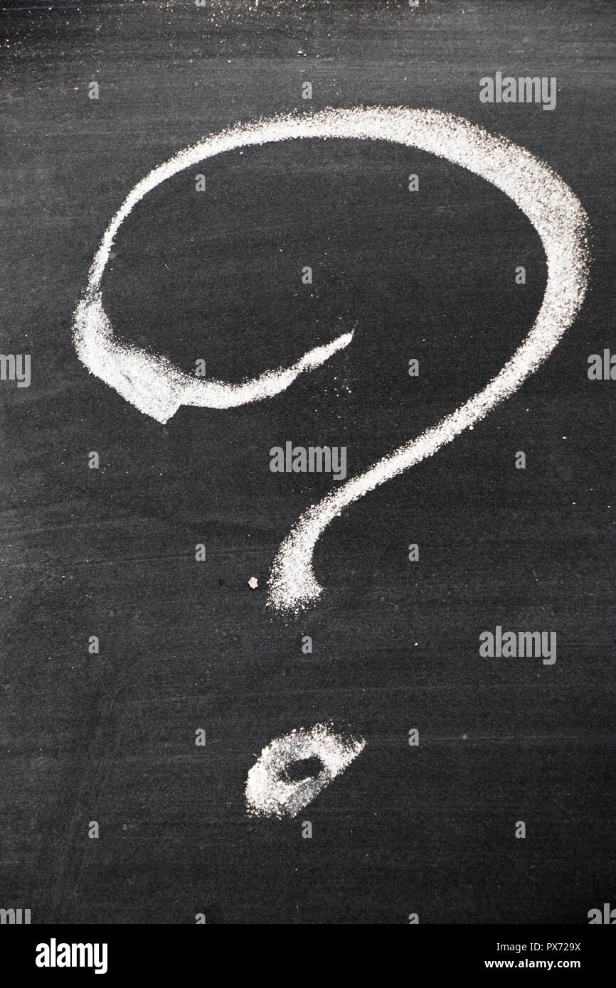 Chalk hand drawing as question mark shape on black board background ...