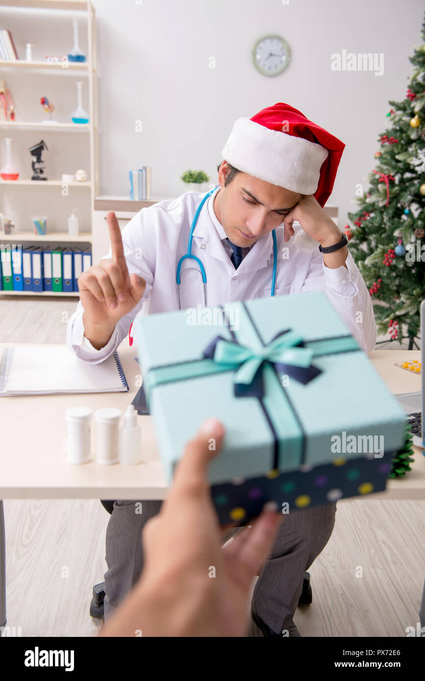 Doctor with gift box in the hospital Stock Photo - Alamy
