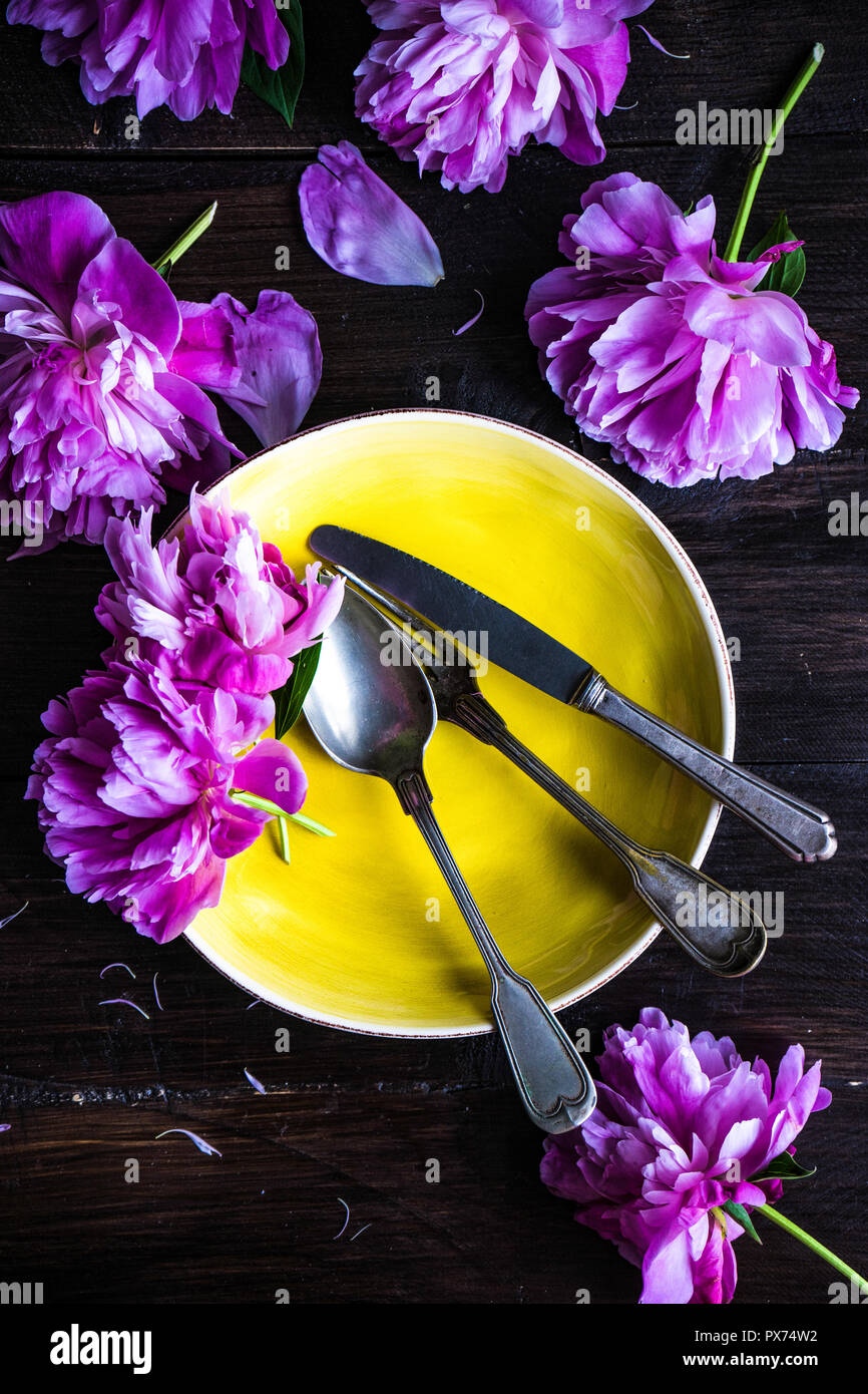 Summer table setting with pink peony flowers on rustic background with copy space Stock Photo ...
