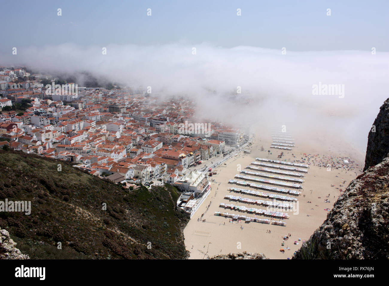 A sea haar over the beach at Nazare in western Portugal Stock Photo - Alamy